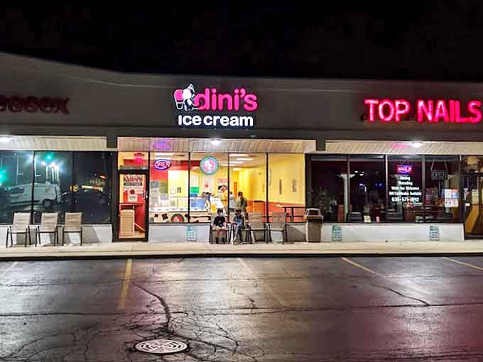 Evening at Dini's transforms an ordinary strip mall into a community gathering spot, where ice cream brings strangers together under neon lights.