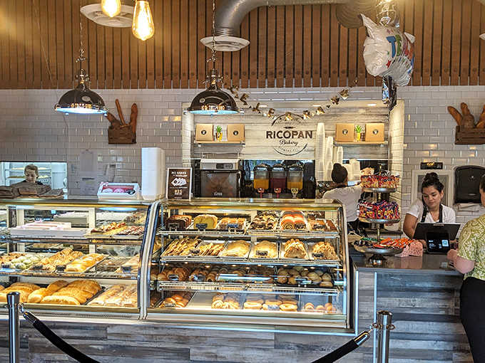 Display Case: A glass-fronted gallery of edible art, where Colombian pastries and breads beckon with golden crusts and promising aromas.