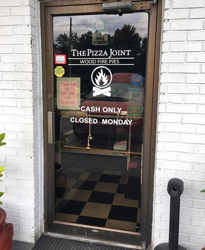 The portal to pizza paradise &ndash; where "Cash Only" isn't an inconvenience but a badge of old-school authenticity.