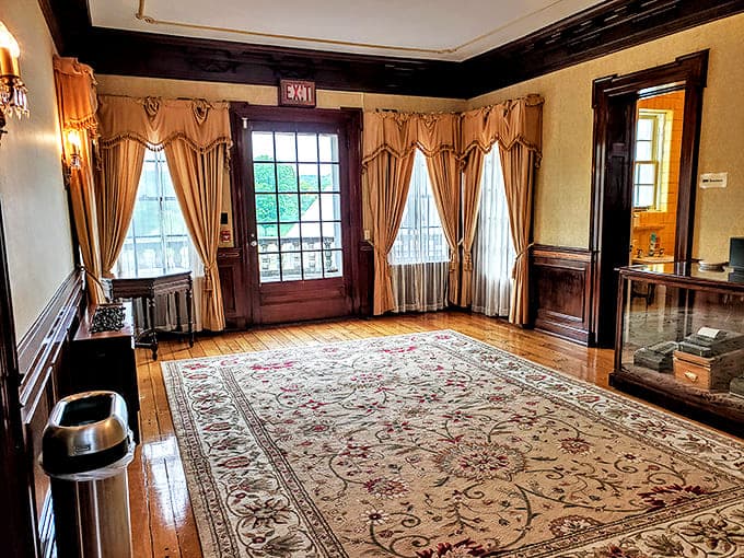 Foyer: Elegant draperies frame doorways in this welcoming entrance space, where polished floors have supported both celebration and solemnity.