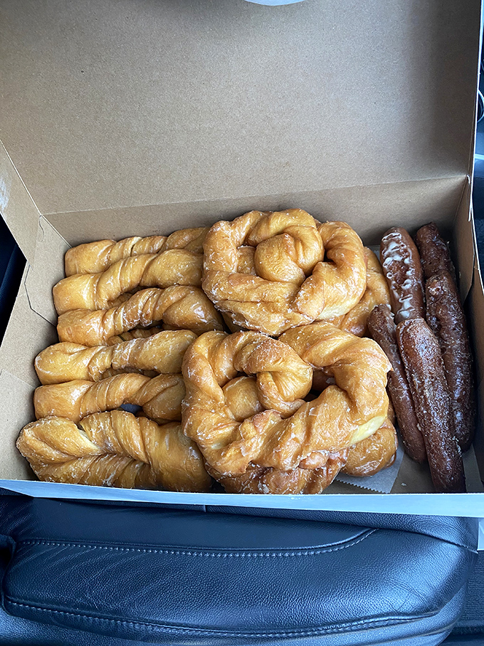 Glazed Twists: Pillowy perfection in twisted form &ndash; these golden beauties glisten with sweet glaze that crackles with each heavenly bite.