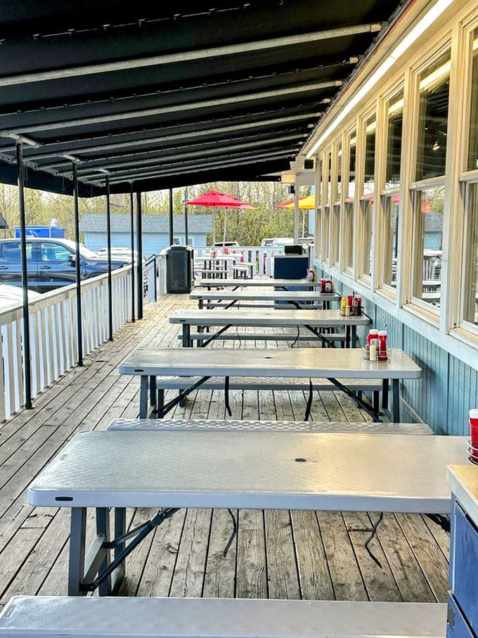 Outdoor seating under the covered porch offers the perfect summer dining experience where fresh air makes everything taste better.