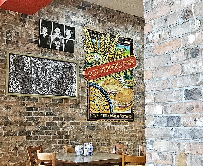 Exposed brick walls showcase Beatles artwork and memorabilia, creating an immersive experience that celebrates both music history and Springfield's unique food culture.