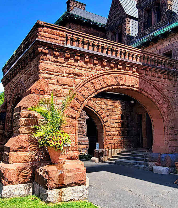Arches that make your front door look like a mouse hole. Plants strategically placed to remind visitors that wealth can make anything grow in Minnesota.