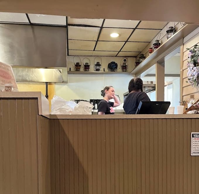 The friendly counter staff ready to help you navigate the menu and start your delicious journey through Jocko's offerings.