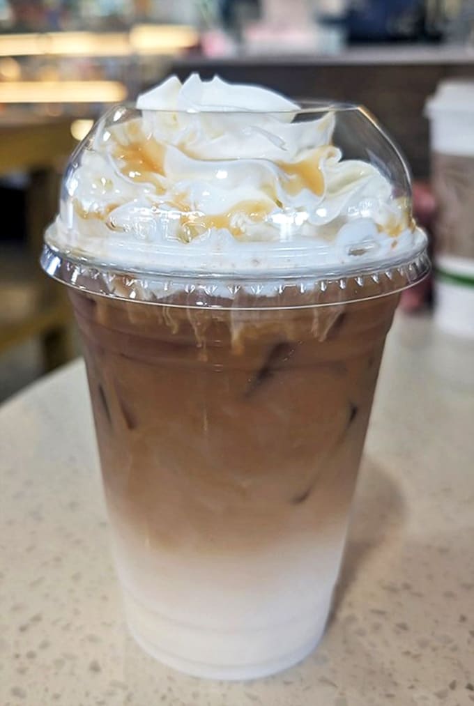 This iced caramel macchiato topped with whipped cream and caramel drizzle is basically dessert in a cup, and nobody's complaining about that.