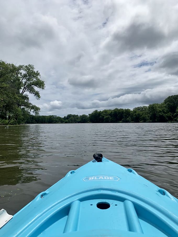 Kayak launch: From this blue vessel's vantage point, paddlers embark on water-level adventures where office worries dissolve with each gentle stroke.