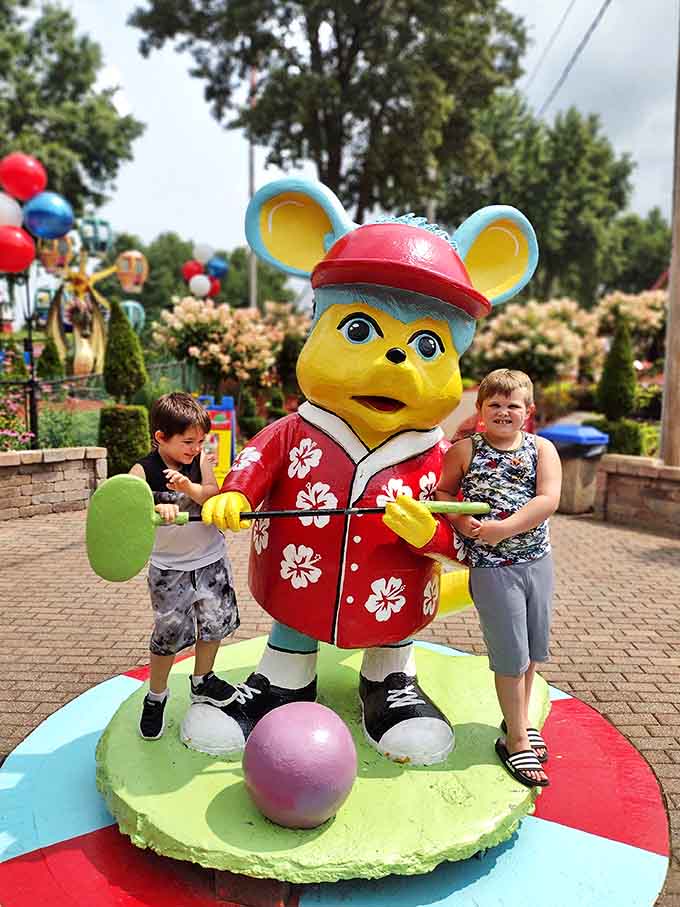 The park's colorful mascot poses with young visitors, creating that perfect souvenir photo parents will embarrass their kids with years later.