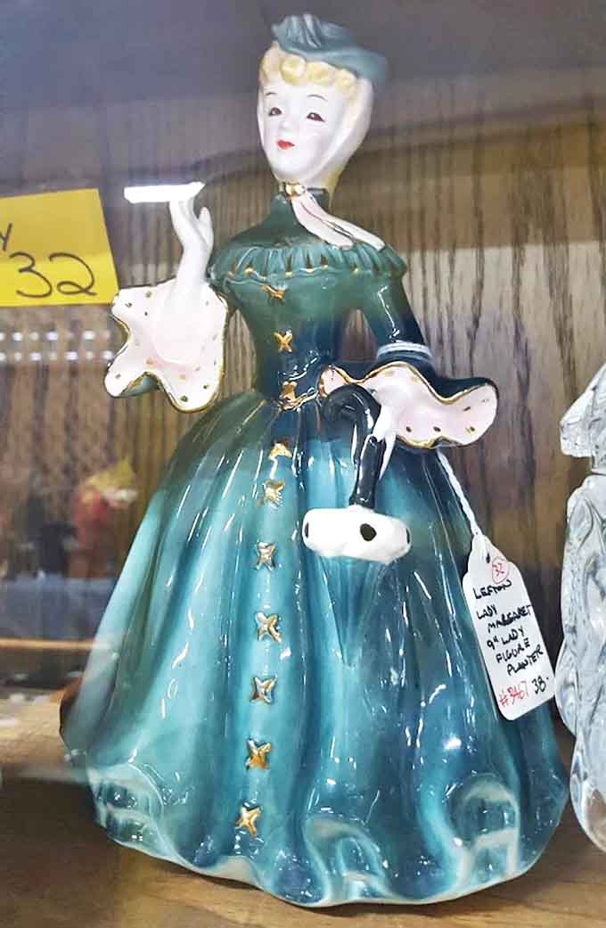 This elegant figurine in teal dress once graced a mid-century mantelpiece &ndash; now waiting for her second act in a modern home.