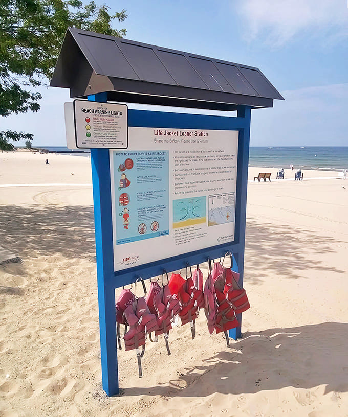 The life jacket loaner station &ndash; because nothing says "I care about water safety" like borrowing a vest worn by countless strangers before you.
