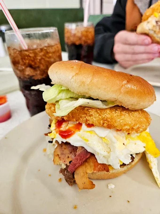 Loaded chicken Burger: Breakfast meets lunch in this towering creation &ndash; crispy chicken, bacon, egg, and cheese stacked so high it needs its own zip code.
