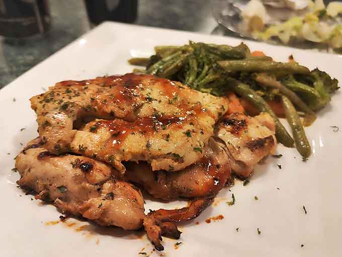 Herb-kissed grilled chicken shares the plate with vibrant green beans &ndash; a healthy option that doesn't sacrifice an ounce of flavor.