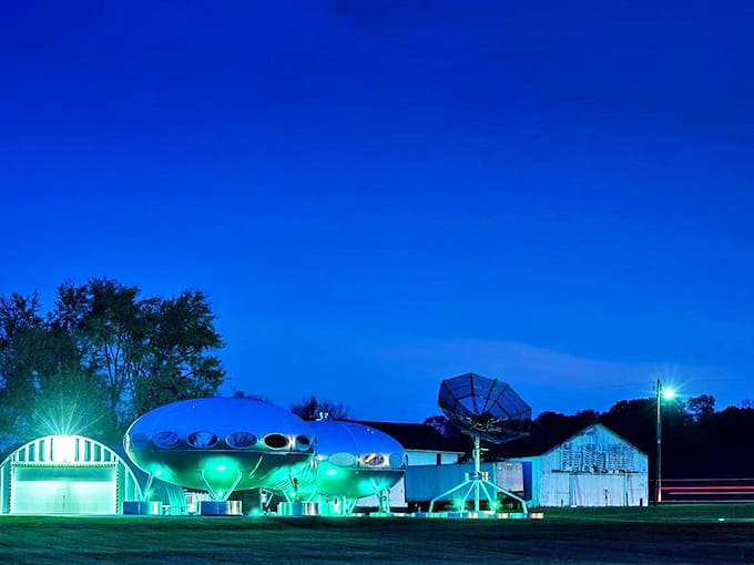 As darkness falls, the Futuro House becomes a beacon of weirdness, its illuminated form glowing like a landed spacecraft against the night sky.