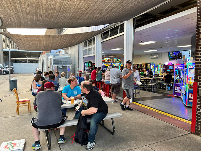 The outdoor patio provides a perfect respite between gaming sessions, where players can refuel and strategize their next pinball conquest.