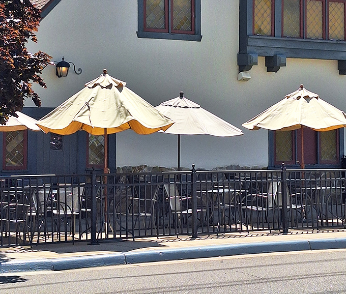 The outdoor patio with its umbrella-shaded tables provides the perfect spot for summer dining and people-watching along historic Eagle Street.