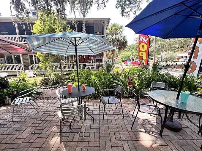 The patio seating area proves that sometimes the best dining room has a sky for a ceiling and birds for background music.
