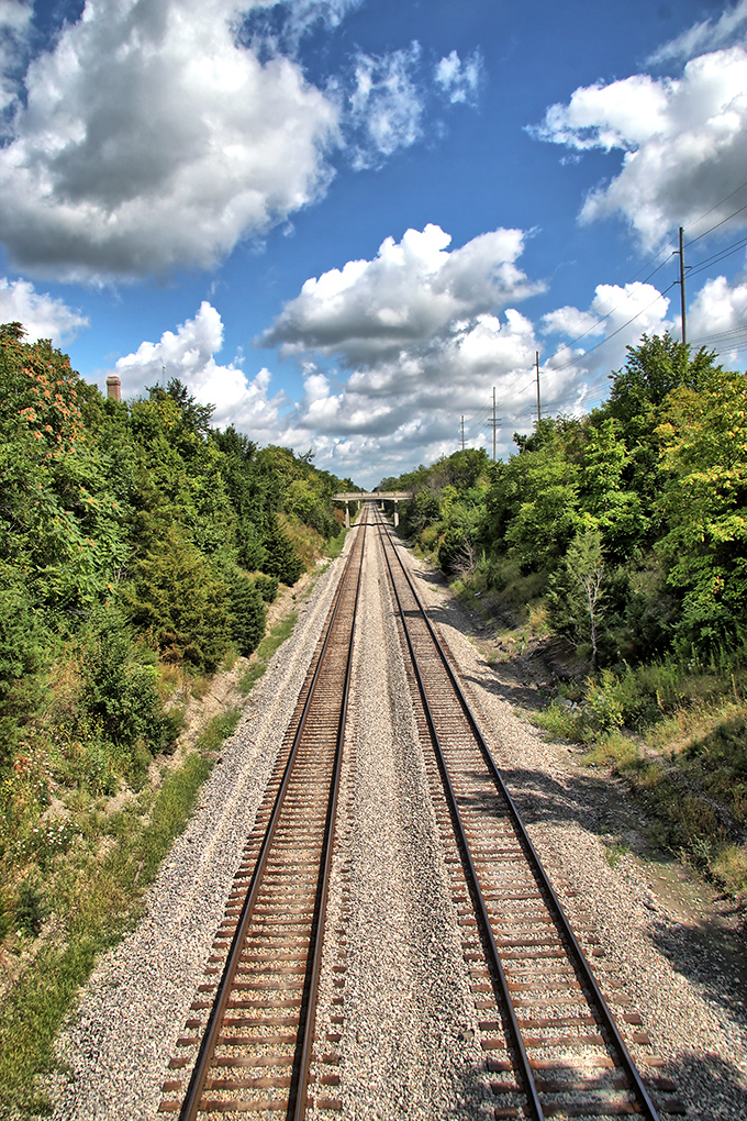 Railroad tracks stretch toward the horizon like steel ribbons, connecting Paxton's storied past with whatever adventures tomorrow might bring.
