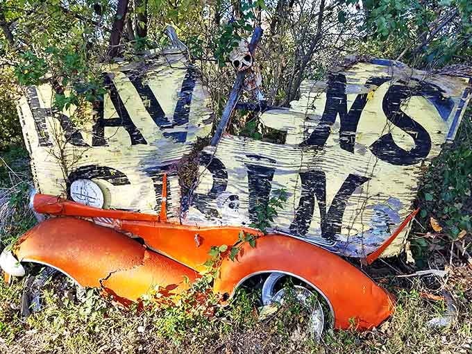 "ALWAYS OPEN" declares the faded orange car hood, a promise and invitation to the perpetually curious traveler.
