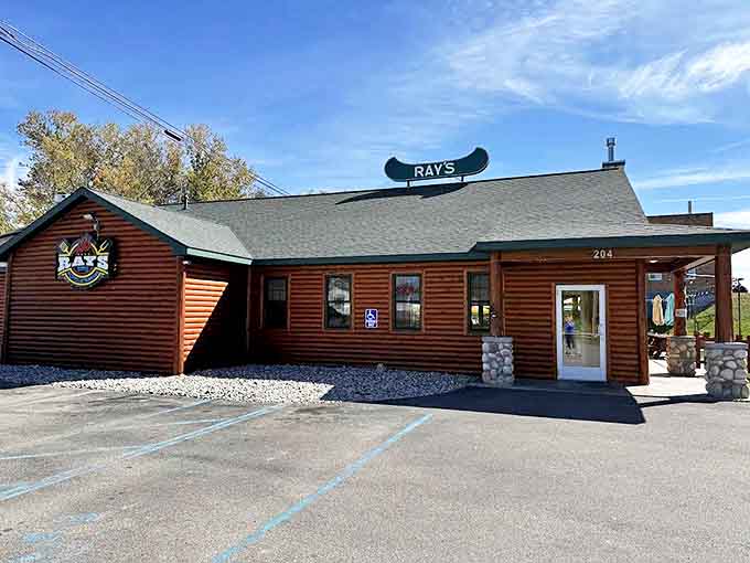 Ray's BBQ promises smoky delights in a rustic log cabin setting that screams "authentic northern Michigan experience."