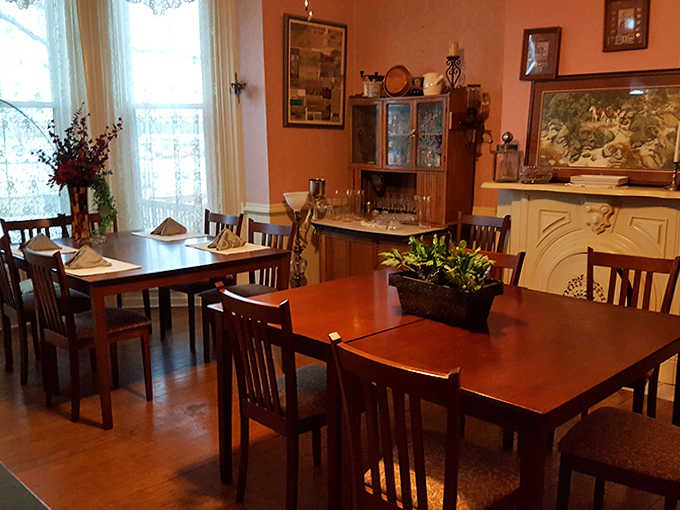 Multiple dining tables ensure breakfast feels intimate even when the mansion hosts a full house of guests.