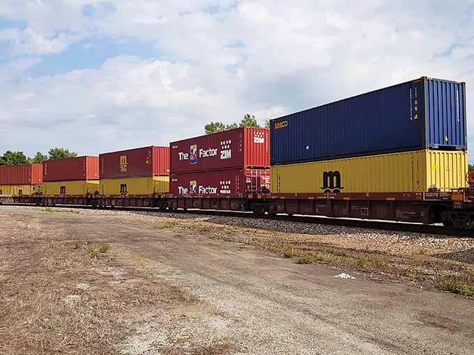 Colorful shipping containers create a moving rainbow of commerce, each box potentially holding items bound for your local store.