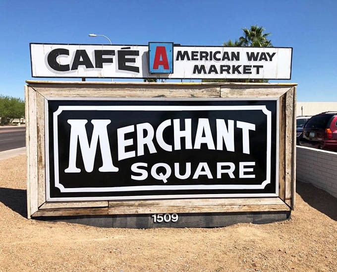 The park's iconic sign stands against a backdrop of the very landscapes it celebrates.