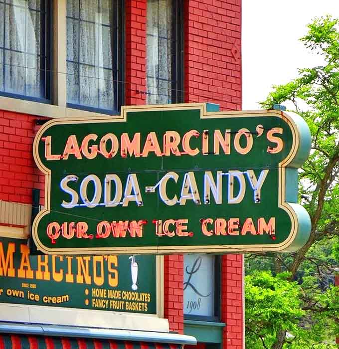 The neon sign glows like a beacon for sweet-toothed pilgrims seeking authentic American confectionery experiences in an increasingly homogenized world.