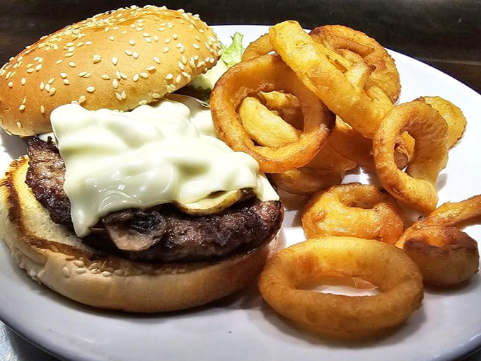 Mushroom Burger topped with melted Swiss and served with onion rings that are actually worth eating, not just tolerating as an afterthought side dish.