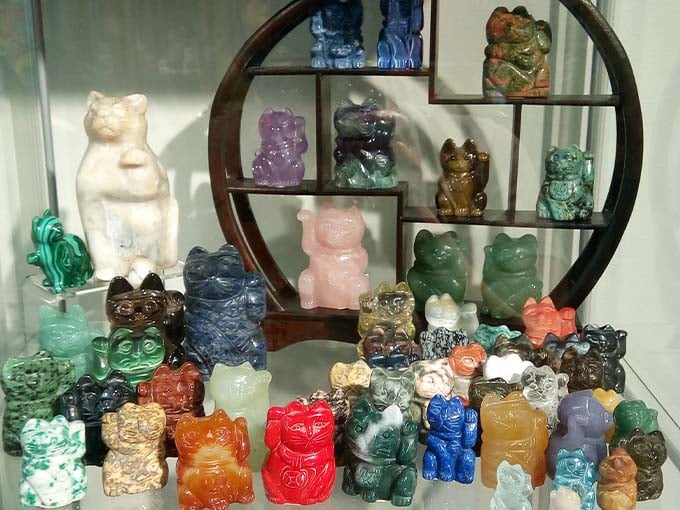 This collection of colorful cat figurines in various gemstones shows how cats have inspired artisans working in every imaginable medium.
