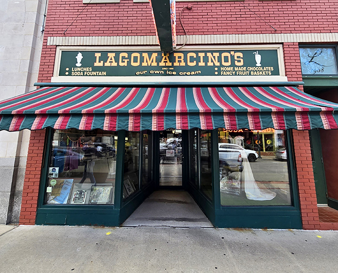 The green and red striped awning serves as a portal to simpler times, when ice cream parlors were the heart of American social life.