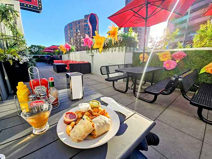 The rooftop patio brings outdoor dining to downtown Minneapolis with colorful flowers and city views included.