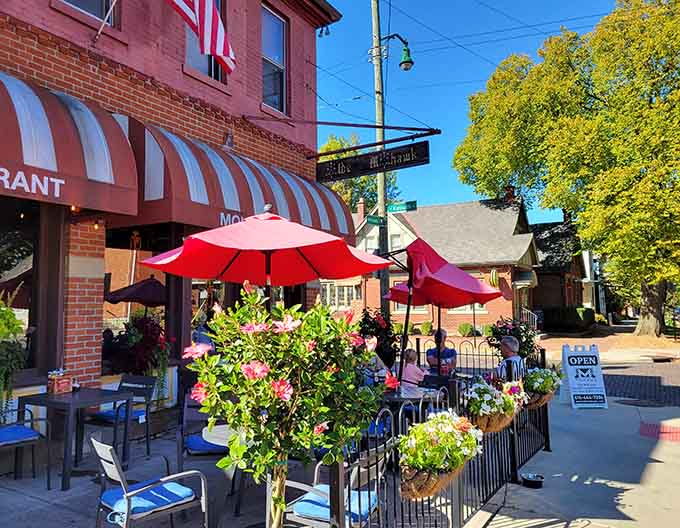 The charming patio with colorful umbrellas and flowers is perfect for enjoying Ohio's beautiful weather with great food.