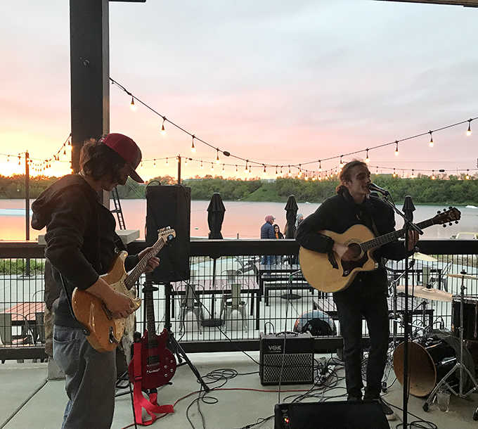 Live music at sunset creates the kind of moment that makes you forget you have responsibilities waiting at home.