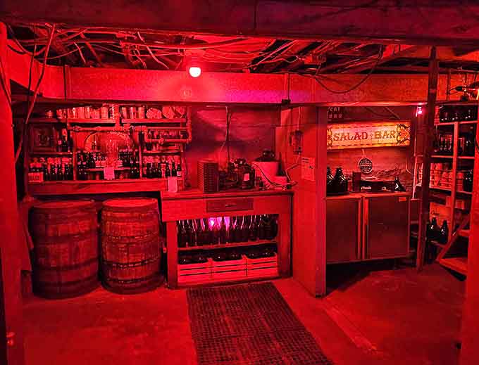 The basement "Salad Bar" sign illuminates what appears to be a former speakeasy, where spirits of both kinds have flowed freely for decades.