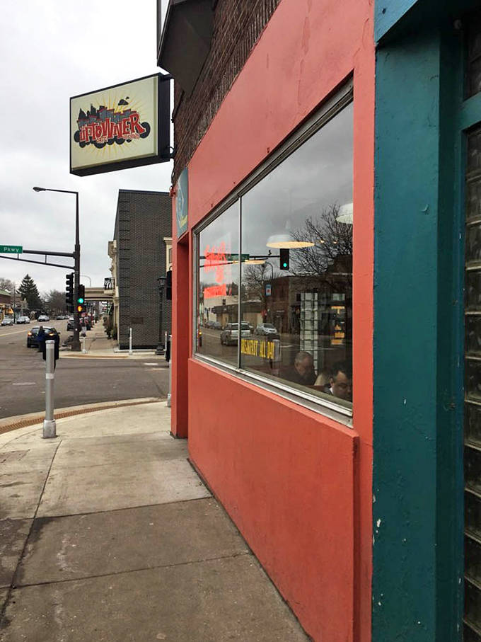 From the sidewalk view, the neon "OPEN" sign beckons hungry passersby with the promise of hashbrowns and happiness waiting inside.