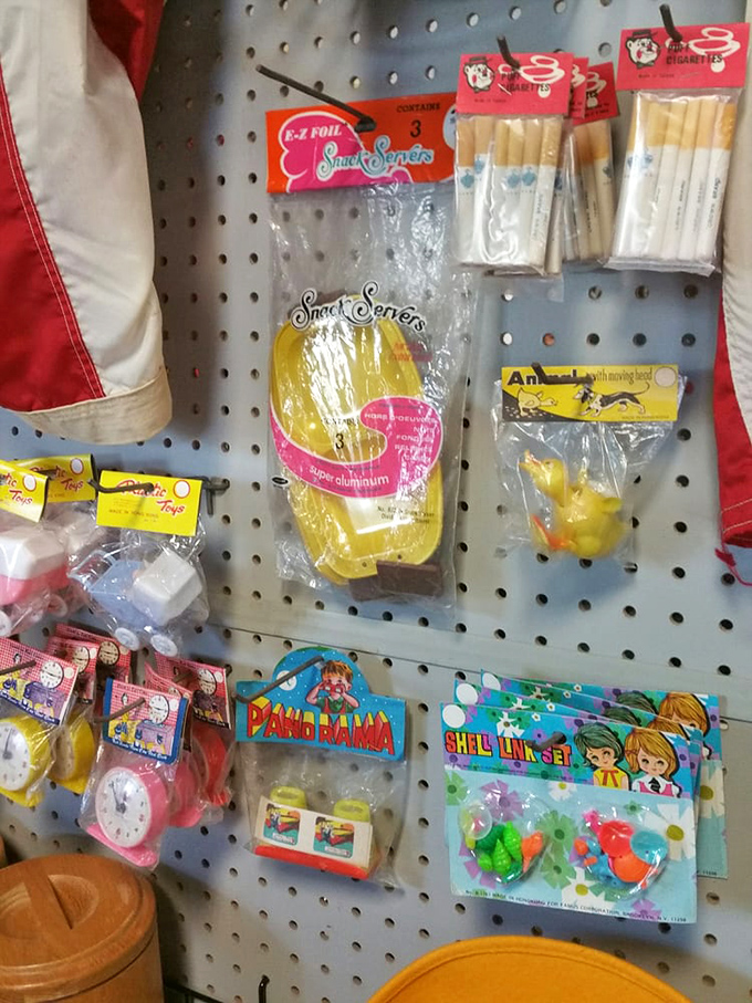 Colorful vintage toys in original packaging – pristine time capsules of childhood joy that survived decades without being torn open on Christmas morning.