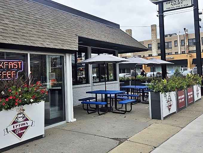 The outdoor seating area with bright blue tables offers a perfect spot to enjoy Minneapolis' precious warm weather days while diving into breakfast excellence.