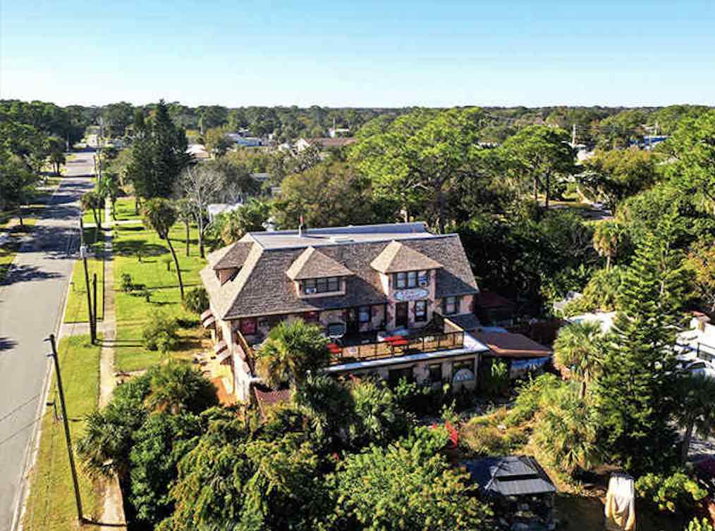 From this aerial view, Casa Coquina reveals itself as an oasis of old-world charm in Florida's coastal landscape.