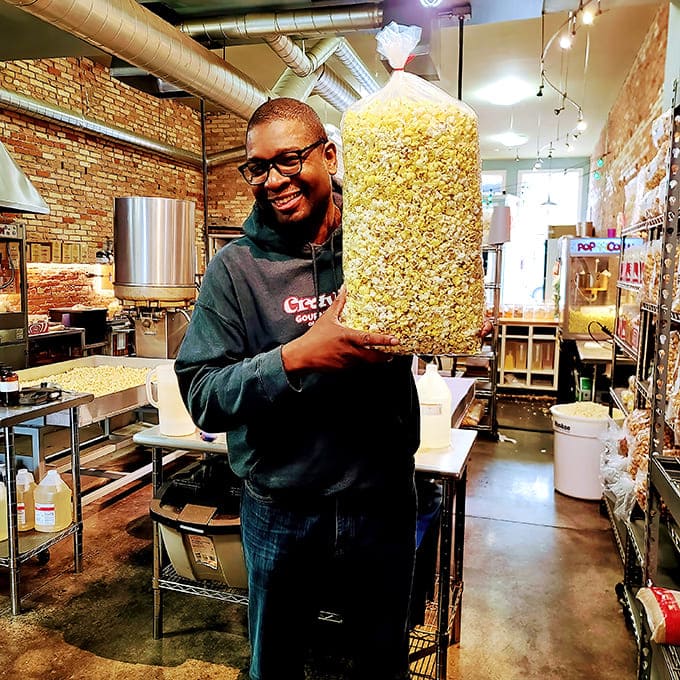 Someone's holding enough popcorn to feed a small village, or one person having a really good weekend, and honestly both scenarios sound perfectly reasonable.