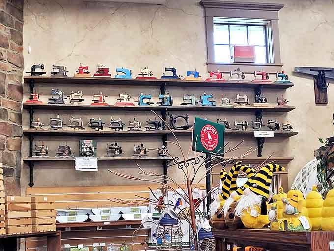 Miniature sewing machines in rainbow hues tell the story of domestic craftsmanship through the decades, tiny ambassadors of a time when mending wasn't optional.