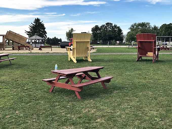 Simple wooden picnic tables invite visitors to rest their feet and enjoy a snack surrounded by the peaceful farm atmosphere.