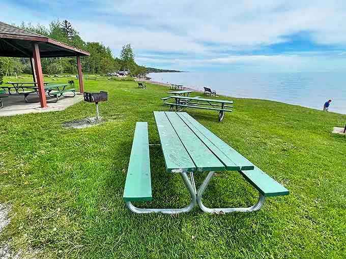 Green picnic tables invite visitors to linger longer, perhaps to examine the day's stone collection while enjoying a lakeside lunch.