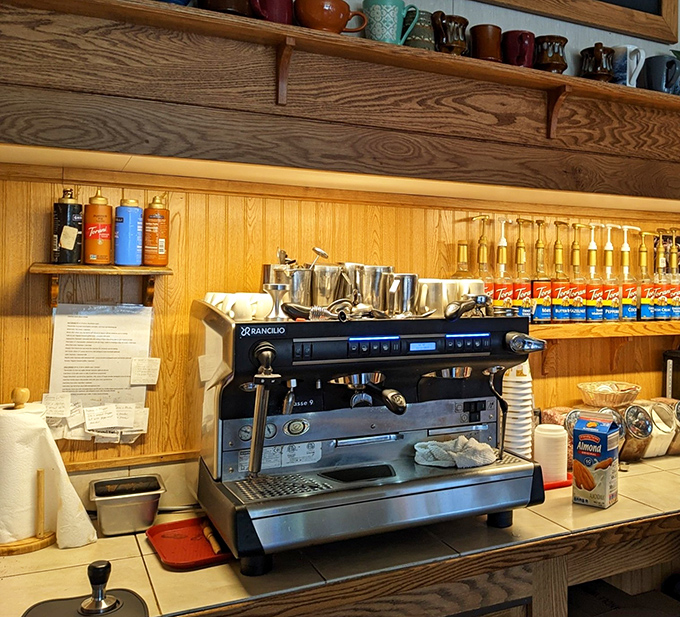 The espresso machine stands ready for service, promising liquid energy to complement your sugar rush.