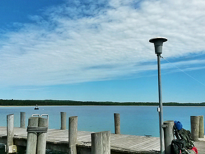 Simple wooden boardwalks lead to extraordinary destinations, proving that sometimes the most memorable journeys don't require passports or security screenings.