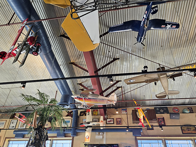 The ceiling's aerial display features everything from vintage biplanes to sleek jets &ndash; an air show that never ends and never charges admission.