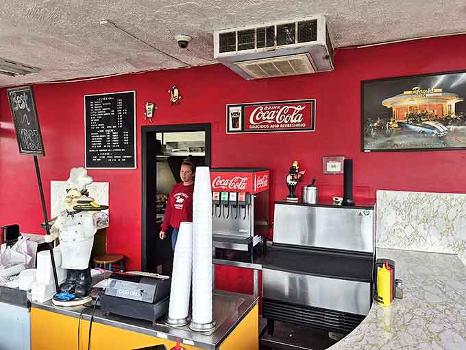 Simplicity reigns at the ordering counter, where Coca-Cola flows freely and burger anticipation builds with every passing minute.