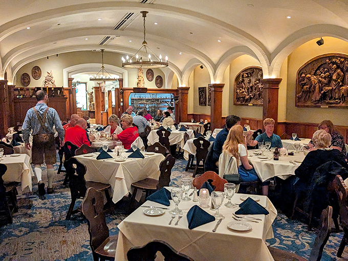 The main dining room during service, where centuries of tradition meet modern appetites under antique chandeliers.