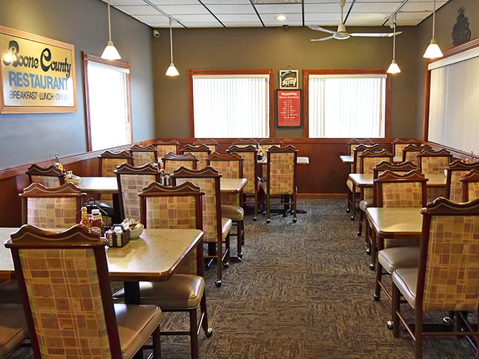 The restaurant's interior offers a warm welcome with hanging plants adding touches of green to the cozy, unpretentious dining space.