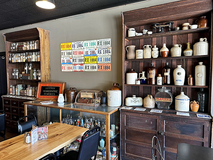 Pharmacy past meets culinary present &ndash; original cabinets and vintage bottles create an authentic backdrop that honors the building's rich history.