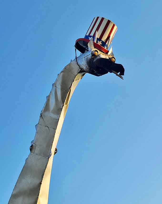 The dragon dons its patriotic top hat, a whimsical touch that showcases the local pride and personality behind this unique attraction.